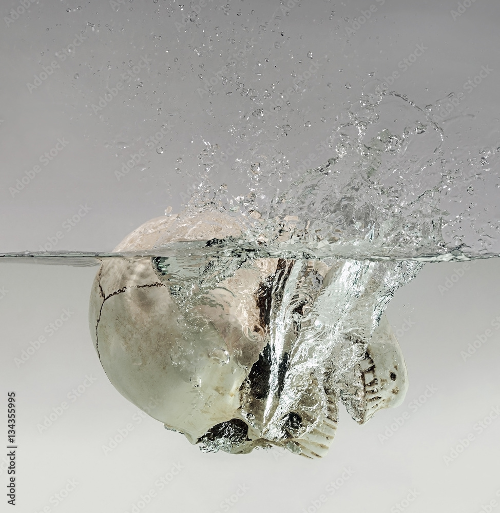 Drowning human skull in the water Stock Photo | Adobe Stock
