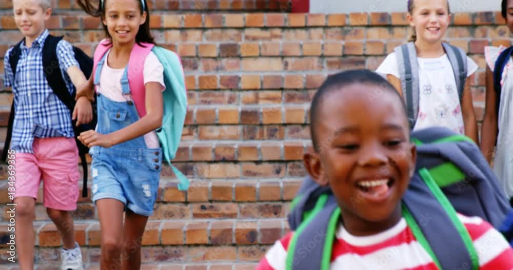 Slow motion of school kids getting down from staircase at school 4k ...