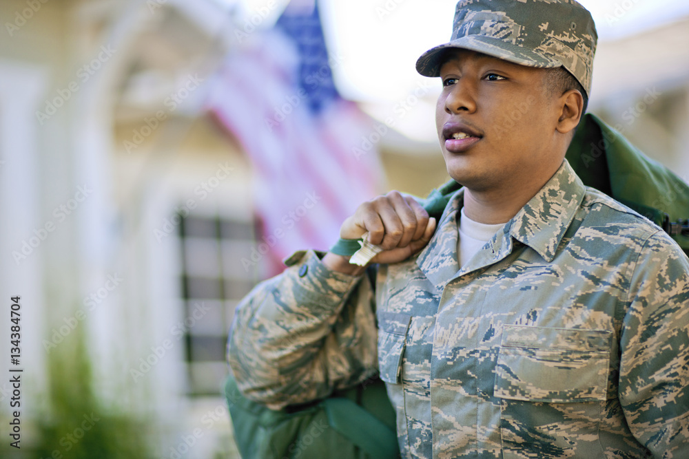 Soldier carrying a bag over his shoulder Stock Photo | Adobe Stock