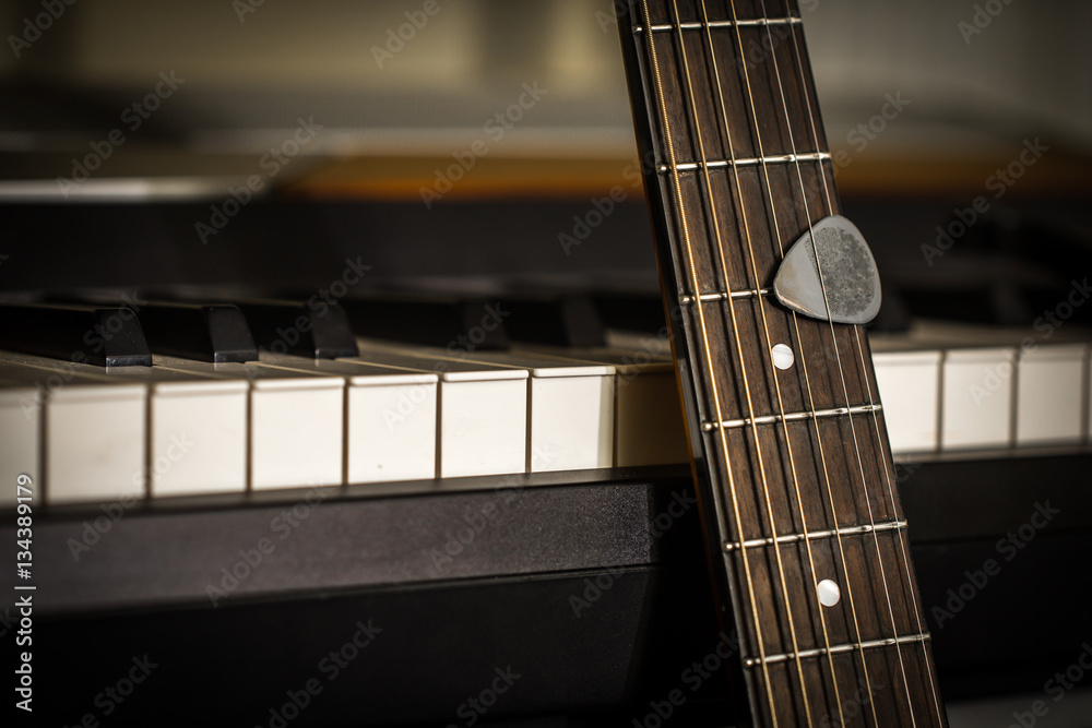 musical instruments piano keys and acoustic guitar with plectrum Stock ...