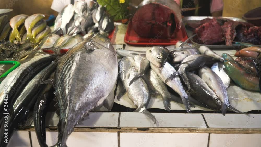 Fresh fish in Asian market. Sale of fresh sea fish in the Asian public ...