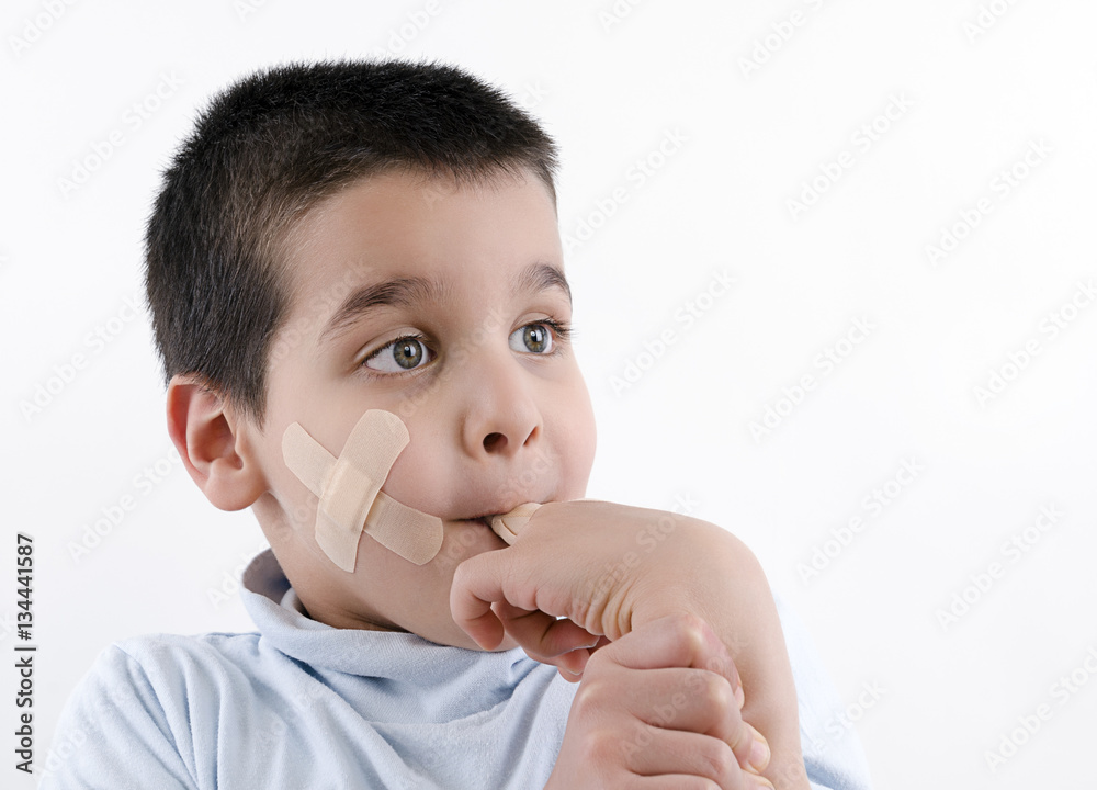 Child with Band Aid on His Face Looking at Copy Space Stock Photo ...