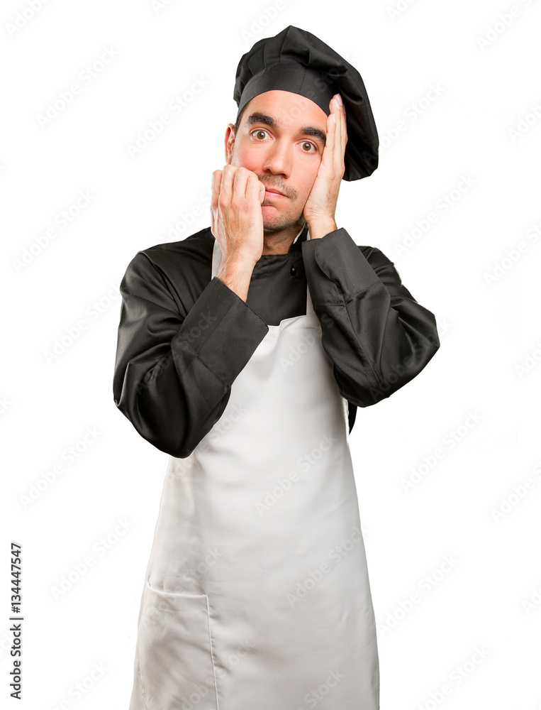 Nervous young chef posing Stock-Foto | Adobe Stock