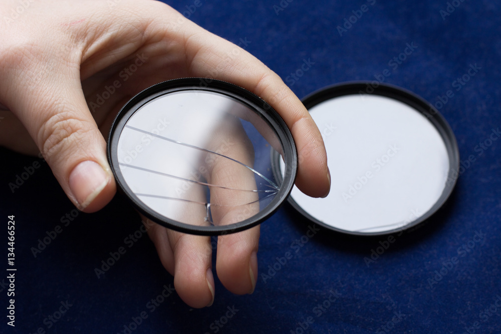 lens filter with a broken glass. camera lens Stock Photo | Adobe Stock
