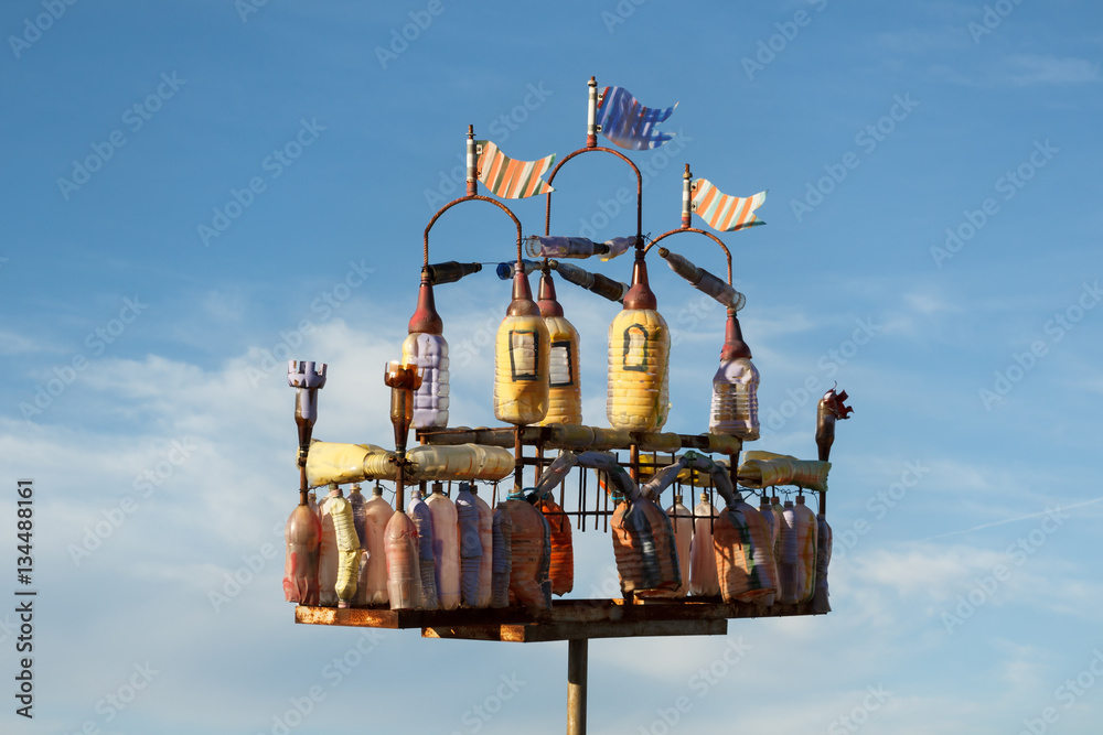 Colorful castle from plastic bottles. The idea of recycling and waste ...