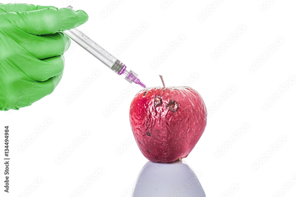 The process of injection in an old apple, concept medical rejuvenation ...