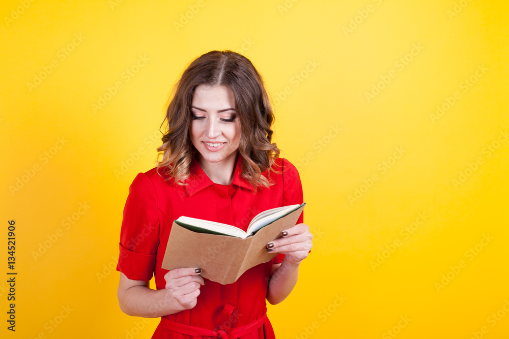 woman in red dress is holding a book Stock Photo | Adobe Stock