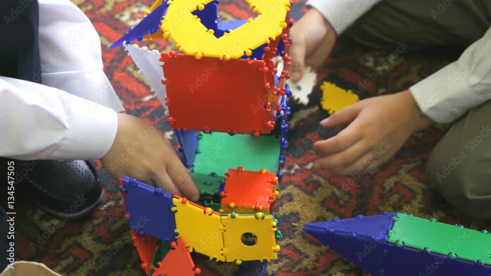 Two kids playing intellectual games at the kindergarten. Close-up Stock ...