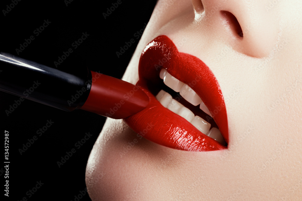 Cosmetics and makeup. Perfect lip makeup. Fashion model applying ...
