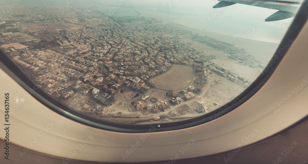 Airplane window view with a landscape scenery background in vintage ...
