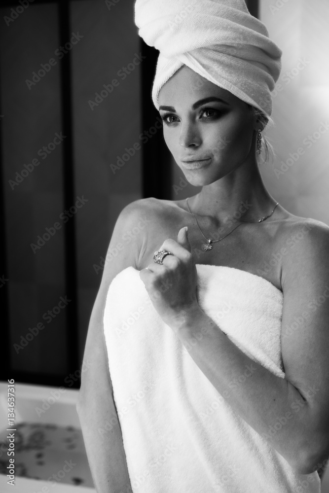 Black and white photo of sensual woman after bath or shower standing in ...