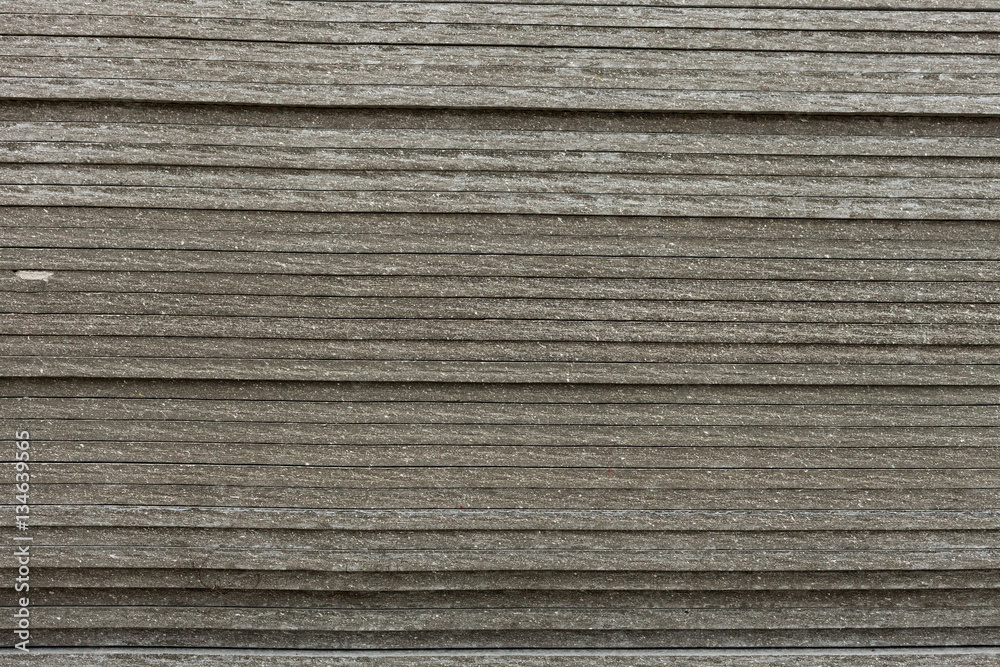 A side view on the Flat slate sheets stacked on each other. Material ...