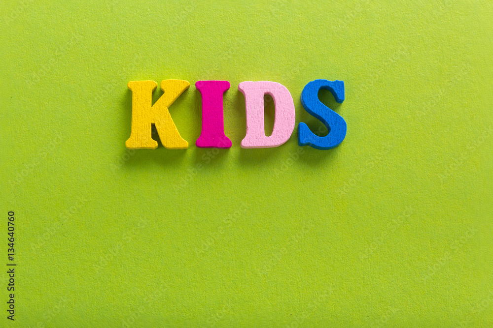 Word kids of English of color wooden letters of the alphabet on a blue ...