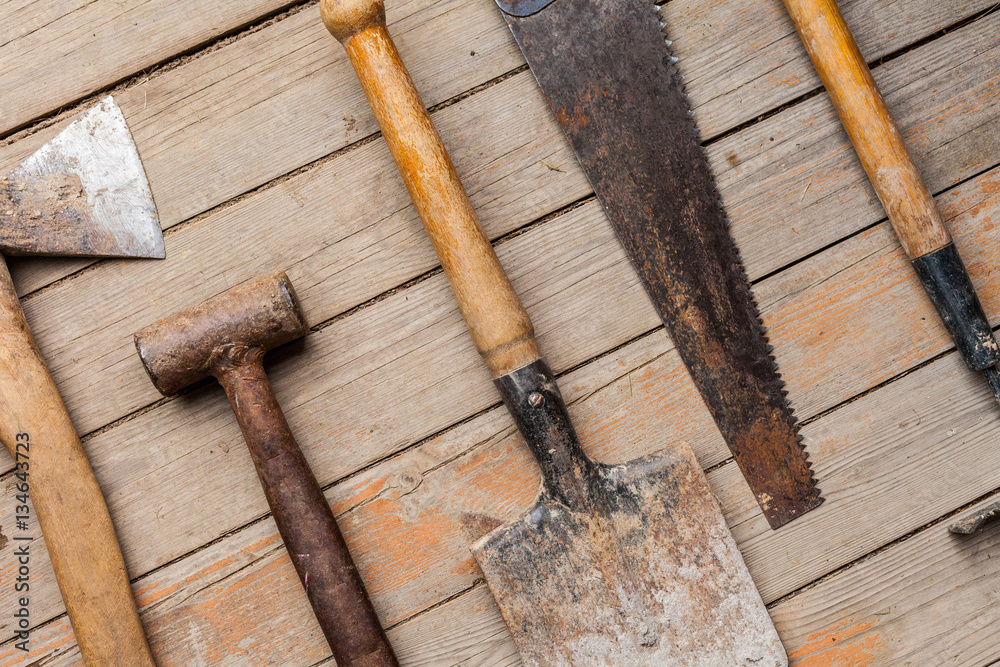 Old rustic tools on wooden texture background. Flat lay with ax ...