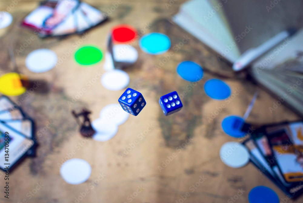 hand throws the dice on background world map Board games Stock Photo ...