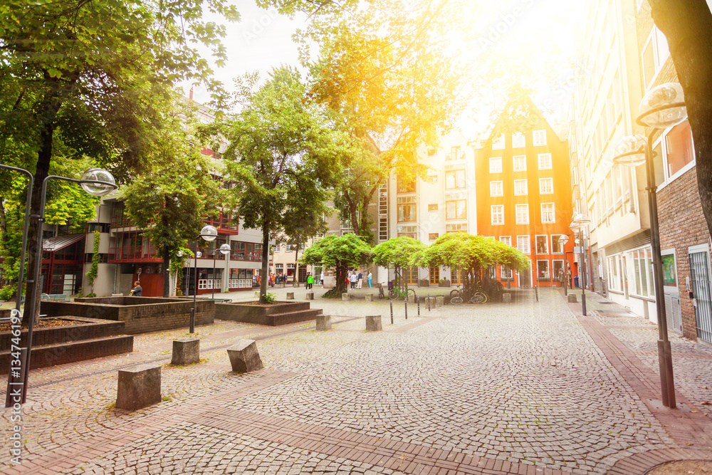 The cozy patio with green in the center of Cologne, Germany. Houses in ...