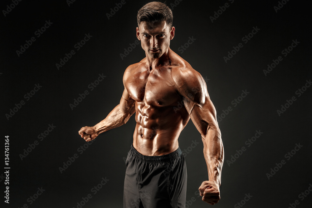 bodybuilder posing. Beautiful sporty guy male power. Fitness muscled ...