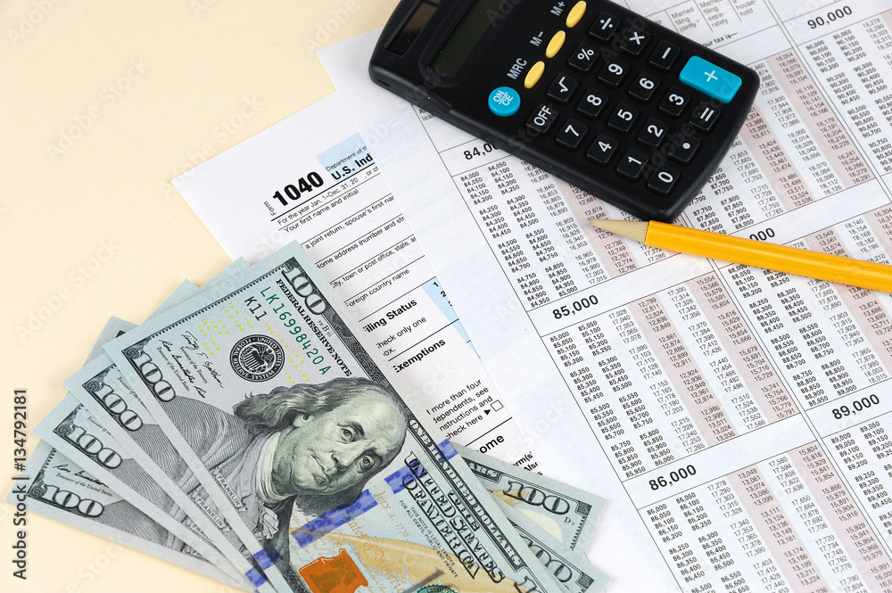 tax calculation form with calculator and pencil on the form Stock Photo ...