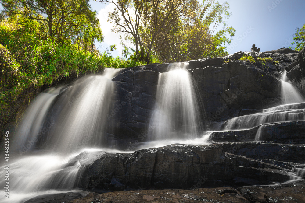 Waterfall and rocks as long exposure capture with motion blur, close to ...