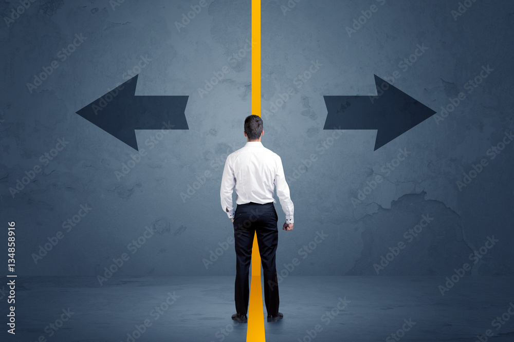 Business person choosing between two options separated by a yell Stock ...
