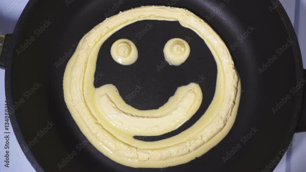 Smiley face made from butter, accelerated video. Butter being heated ...