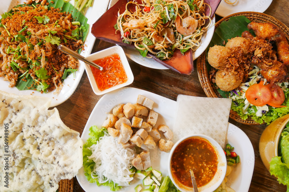 Five of Vietnamese dishes on wood table Stock Photo | Adobe Stock