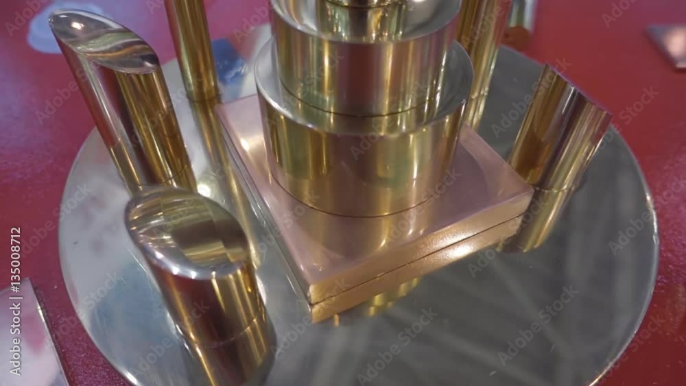 Samples of round rods from brass on the table for assessing a quality ...