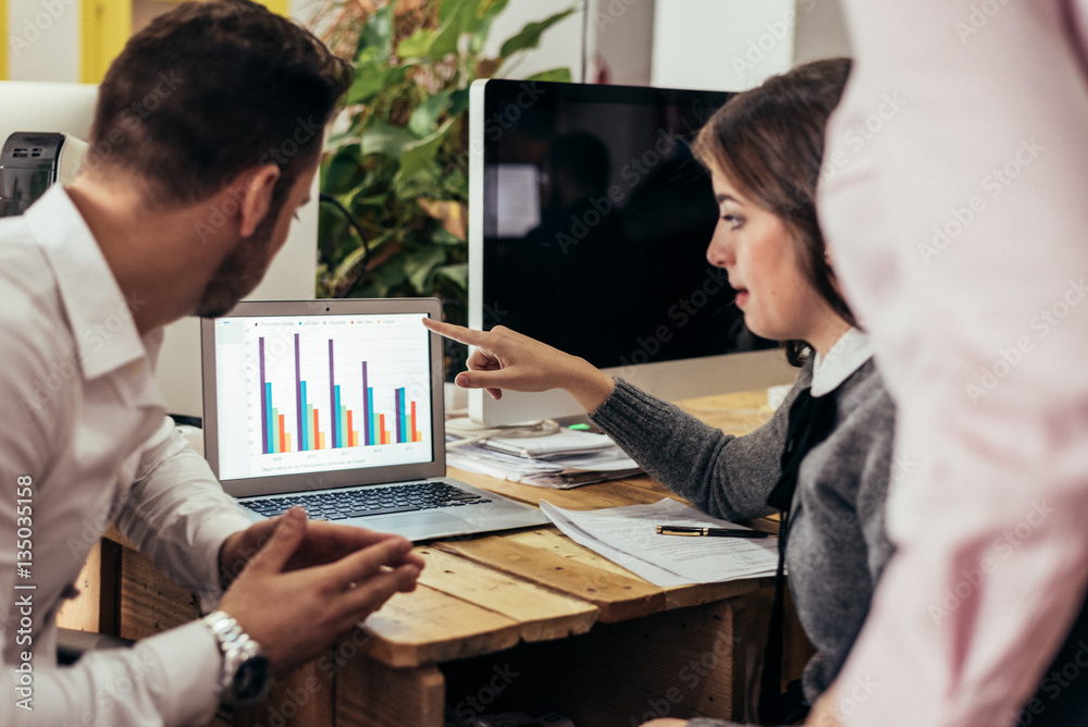 People discussing the diagram Stock Photo | Adobe Stock