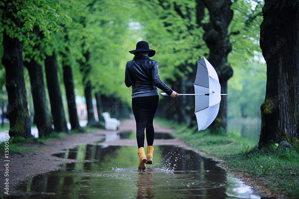 feet in rubber boots rain puddle city Stock Photo | Adobe Stock