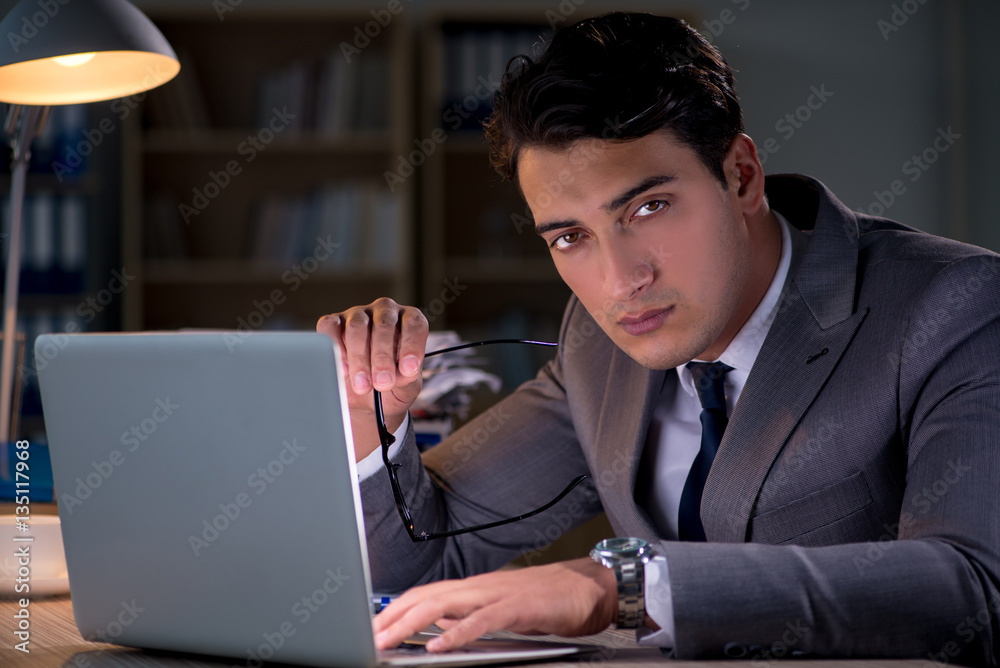 Man staying in the office for long hours Stock Photo | Adobe Stock