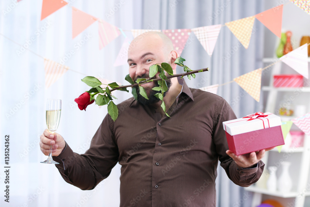 Funny fat man celebrating birthday at home Stock Photo | Adobe Stock