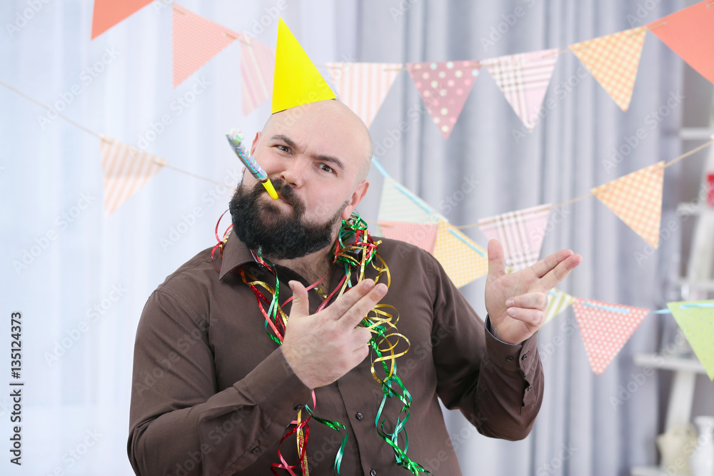 Funny fat man celebrating birthday at home Stock Photo | Adobe Stock