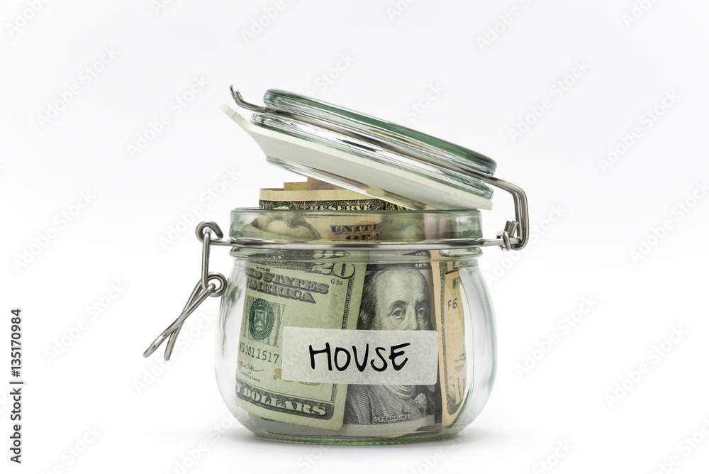 Dollar bills in glass jar isolated on white background. Saving money ...