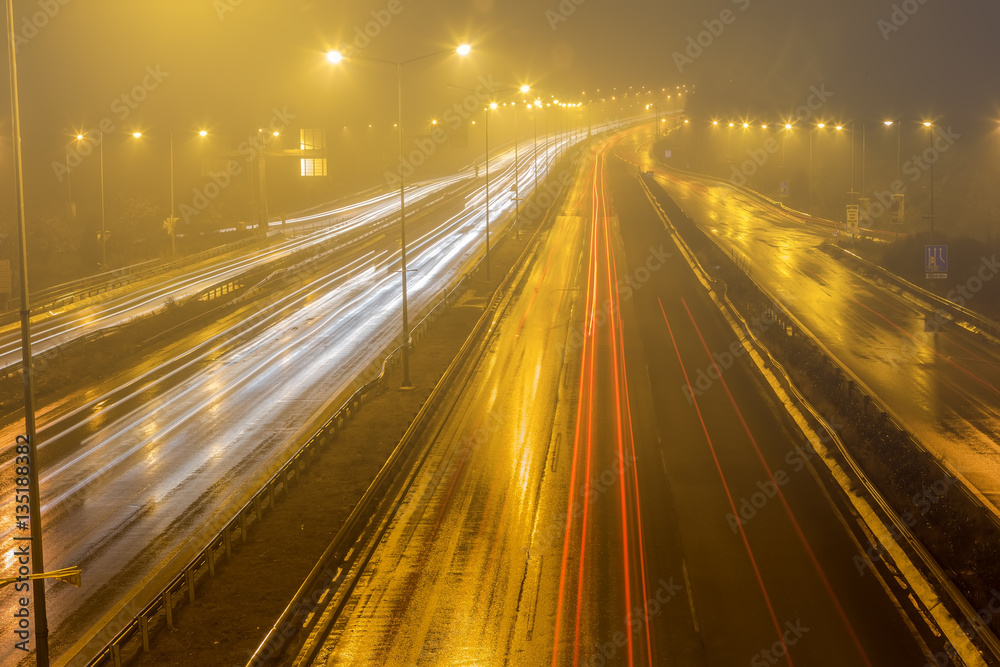 Speed Traffic - light trails on motorway highway at night Stock Photo ...