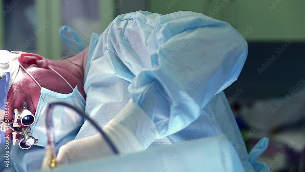 Close-up shot of doctor surgeon operating a patient in hospital ...
