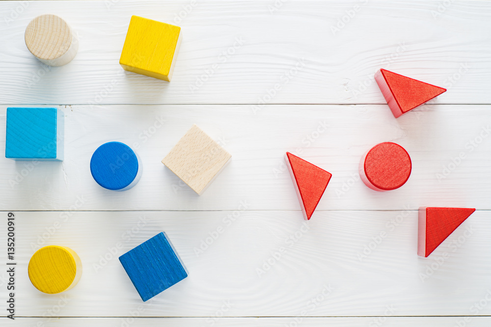 Colorful wooden blocks on white background, top view, flat lay ...