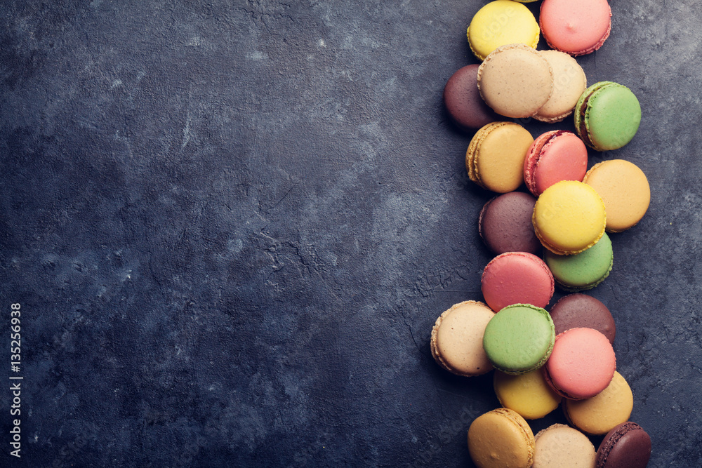 Colorful macaroons on stone table. Sweet macarons Stock-Foto | Adobe Stock