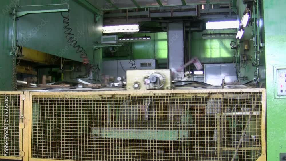 The mechanism reverses the detail for car and feeds it into the press ...