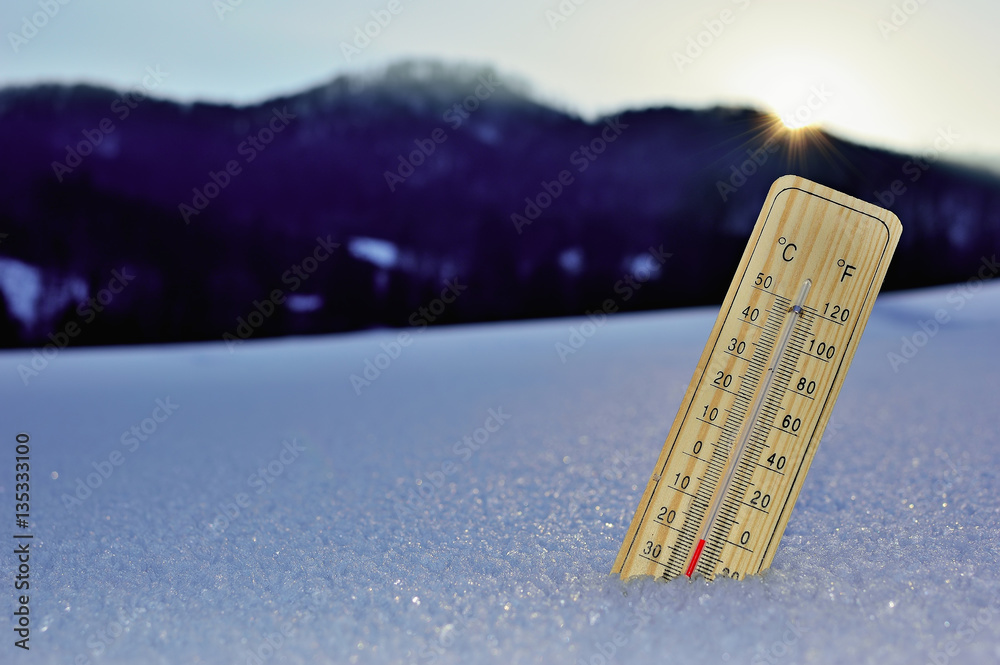Mercury wooden thermometer stuck on snow shows very low temperatures ...