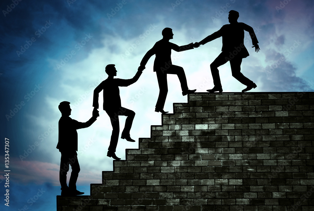 Team leader pulling his workers to the top of the stairs, suppor Stock ...