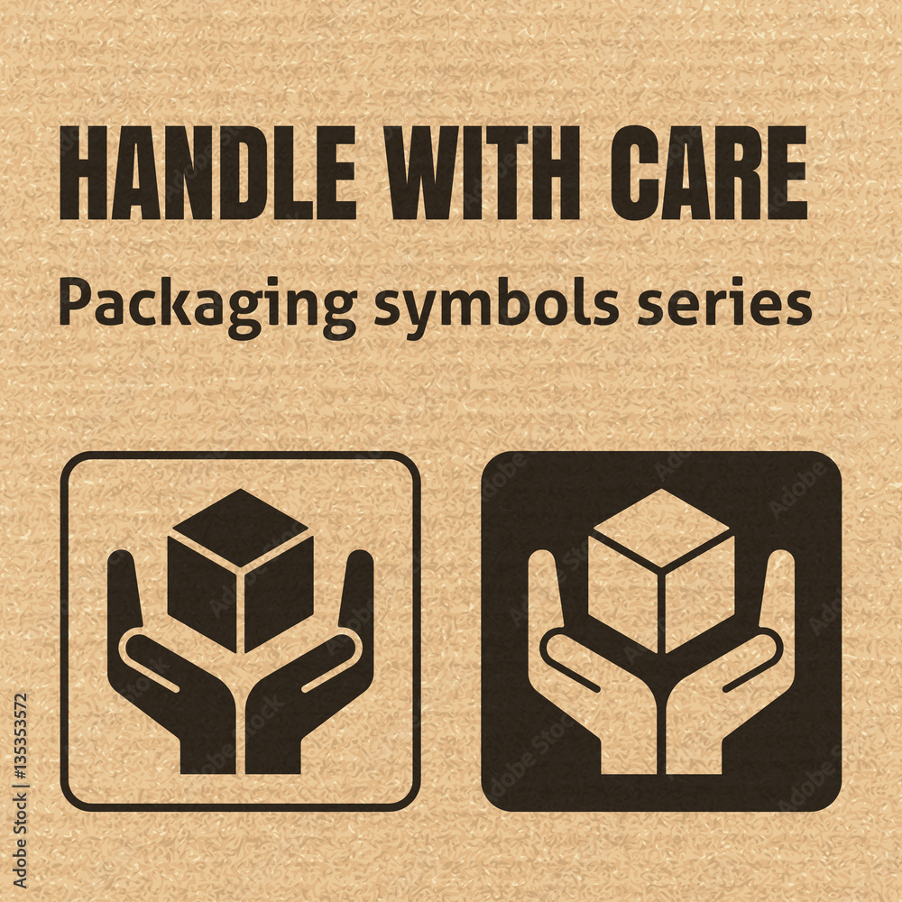 HANDLE WITH CARE packaging symbol on a corrugated cardboard background ...