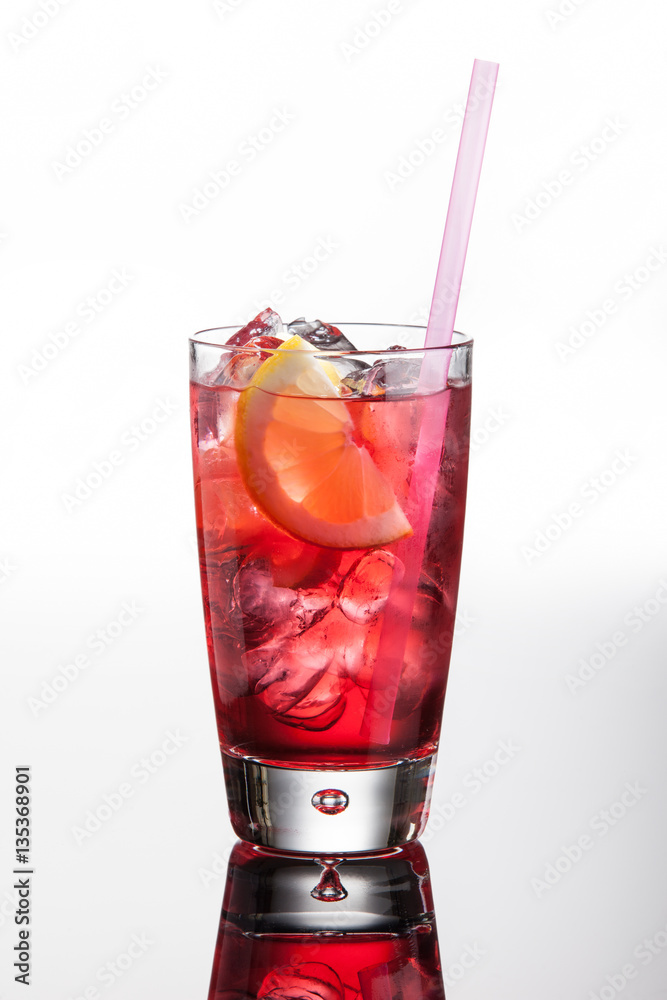 Vodka cocktail with cranberry juice, soda water, lemon and ice. On ...