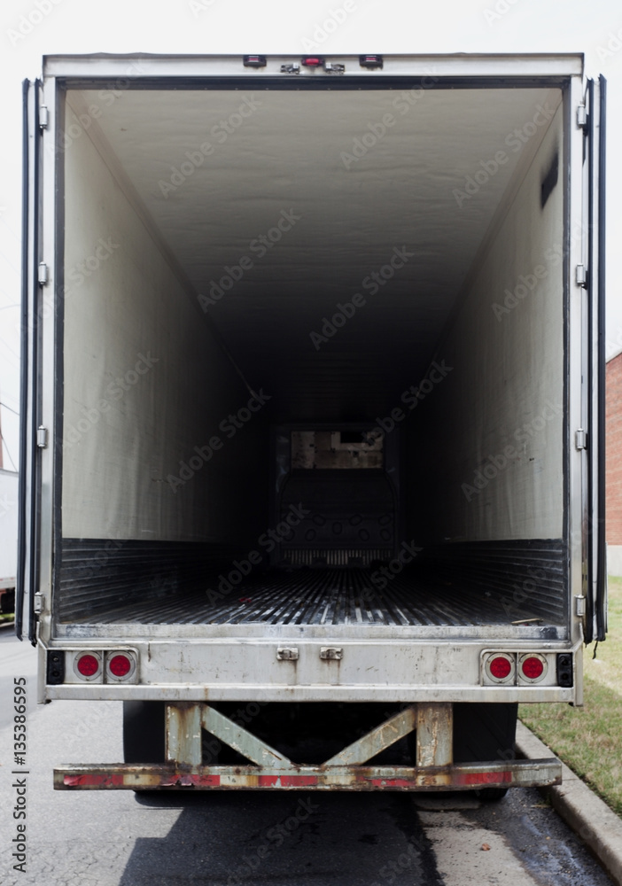Rear view of open empty delivery truck. Stock Photo | Adobe Stock