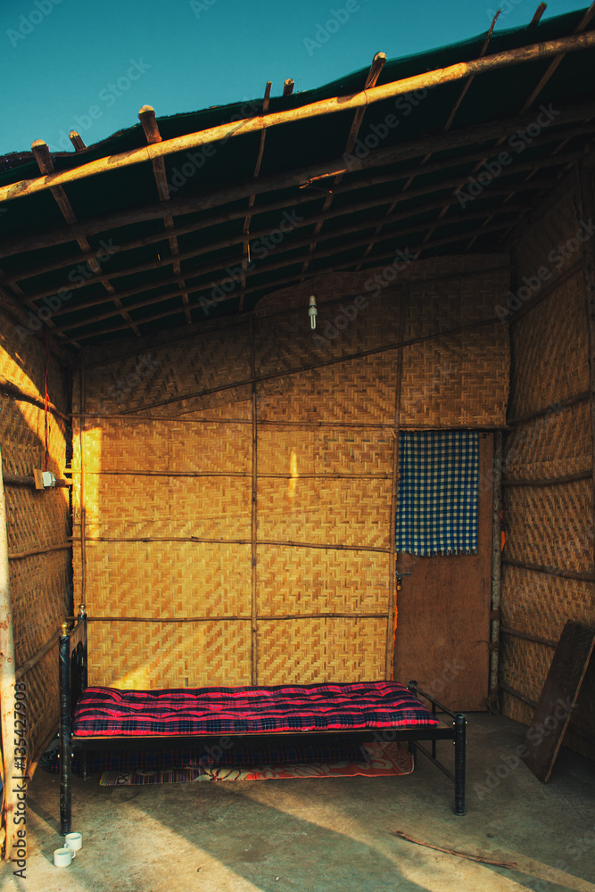 Housing with a bed in the slums of India Stock Photo | Adobe Stock