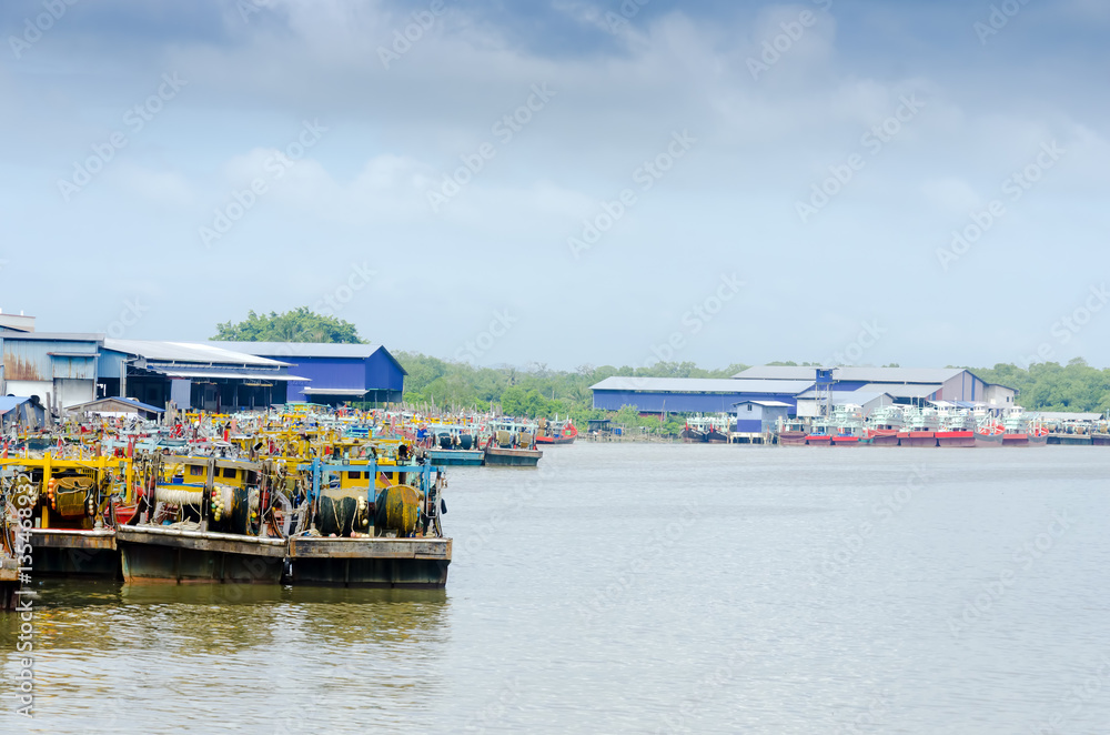 JOHOR, MALAYSIA - JANUARY 30, 2017: Fishing boats anchored at the jetty ...