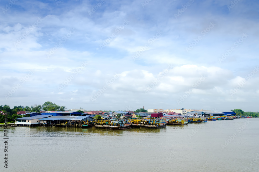 JOHOR, MALAYSIA - JANUARY 30, 2017: Fishing boats anchored at the jetty ...