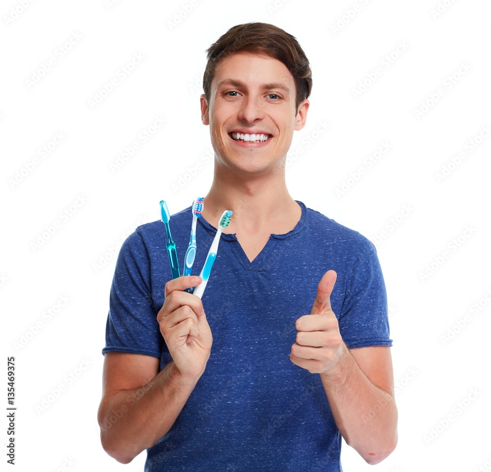 Man with toothbrush. Stock Photo | Adobe Stock