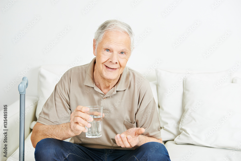 Old man swallowing medicine with water Stock Photo | Adobe Stock