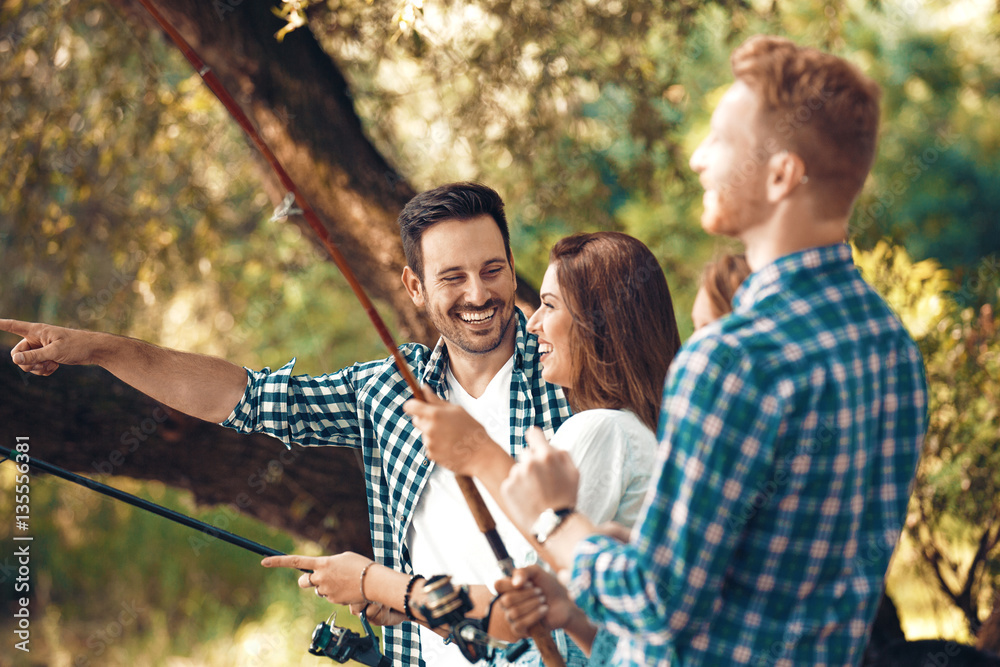 Friends and fishing Stock Photo | Adobe Stock