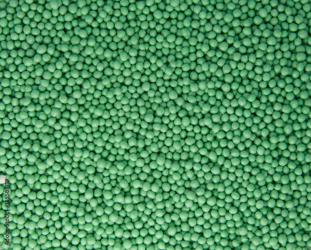 background of small plastic pellets green colored Stock Photo | Adobe Stock